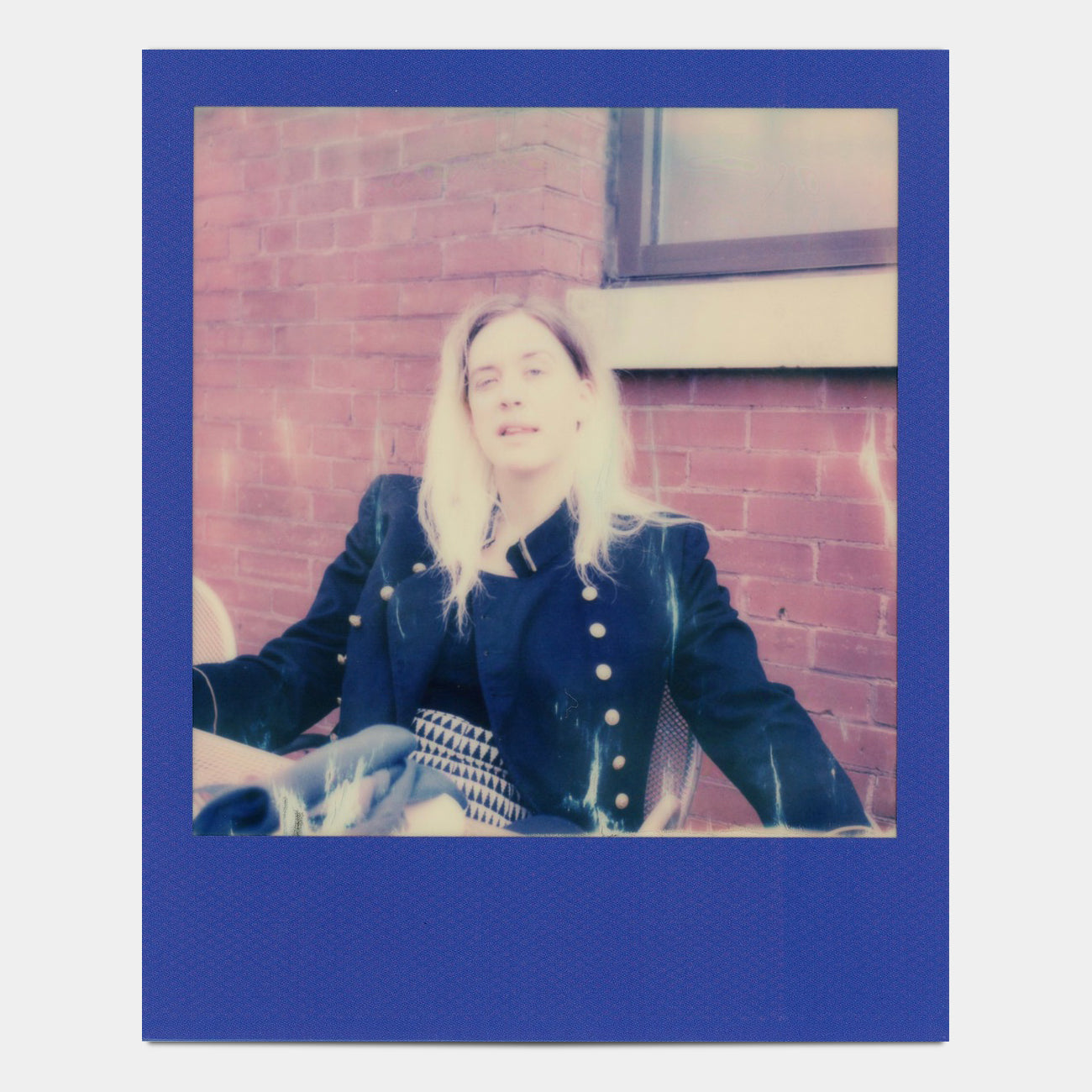 Why are there blue streaks on my Polaroid photo after it finishes deve